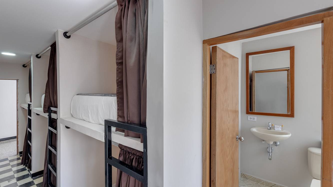 Bed in 12-pod dormitory room | Dorado Plaza Getsemaní in Cartagena ...